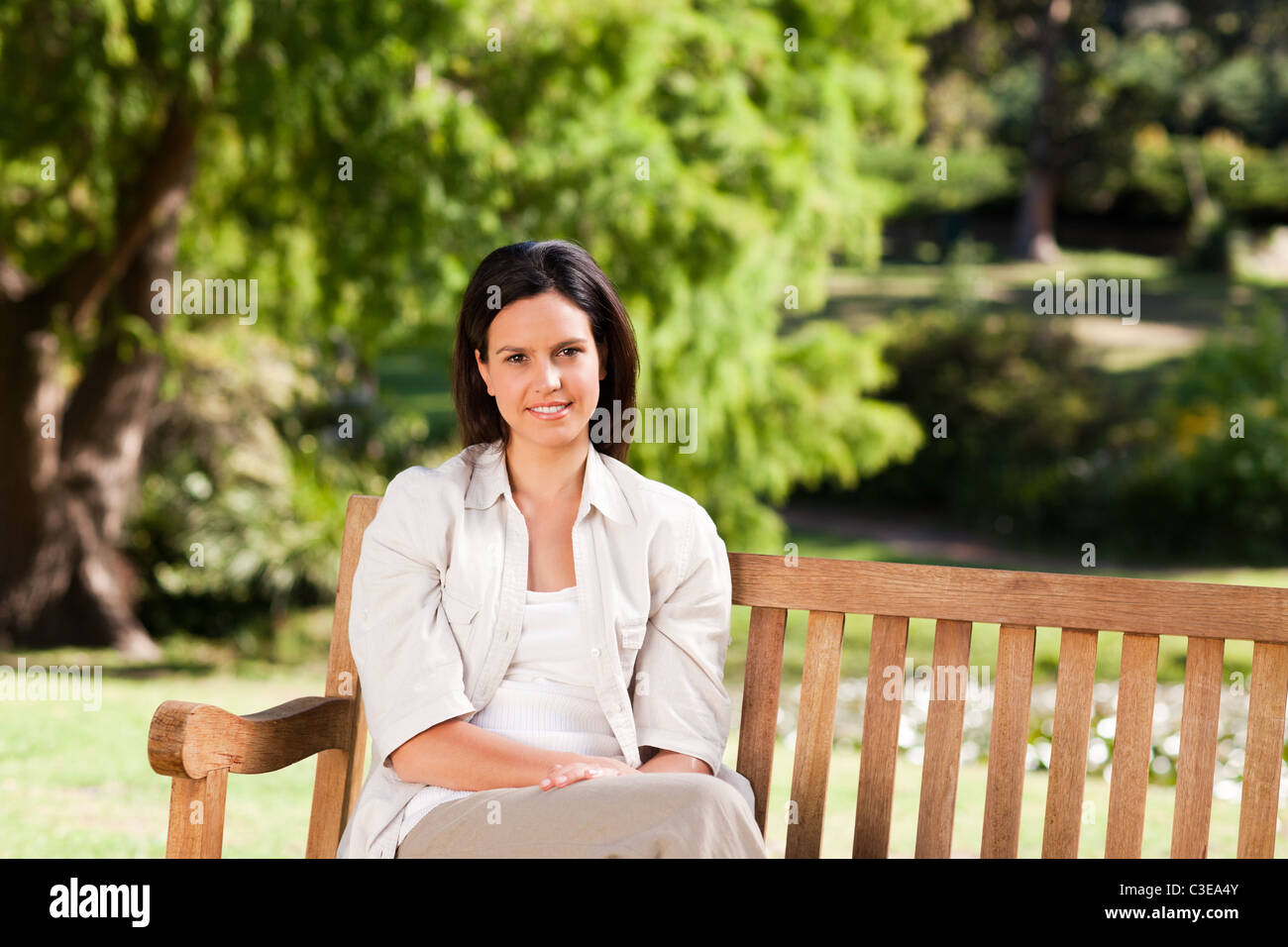 Young woman on the bench Stock Photo - Alamy