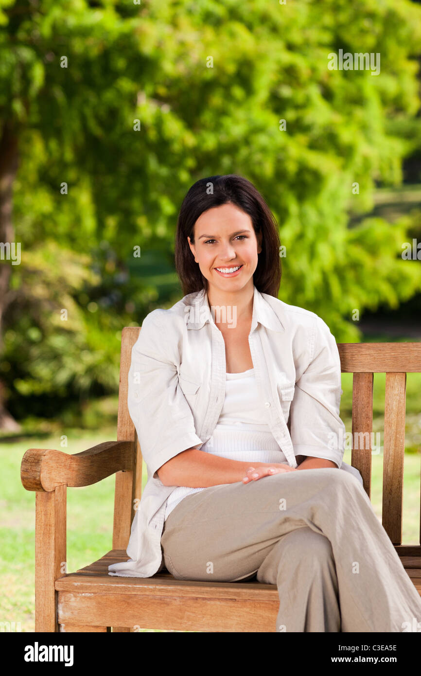 Young woman on the bench Stock Photo - Alamy