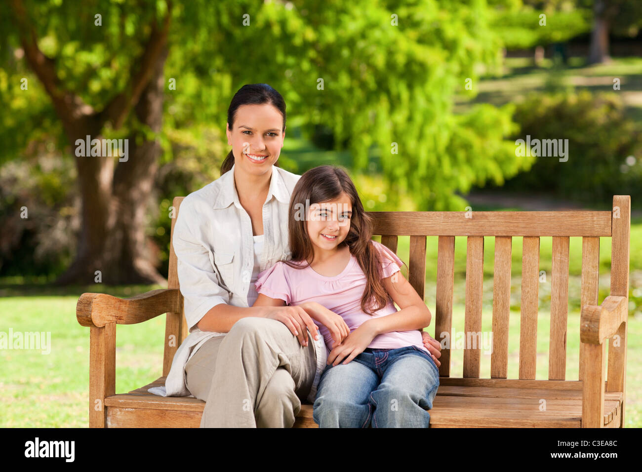 Mother and her daughter on the bench Stock Photo - Alamy