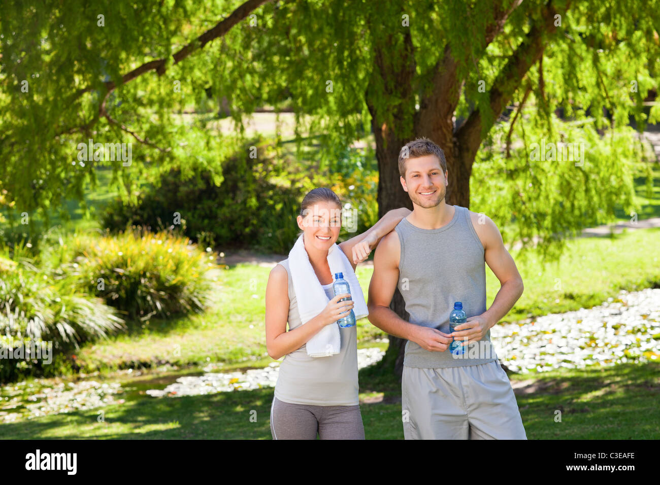 Couple drinking water Stock Photo - Alamy