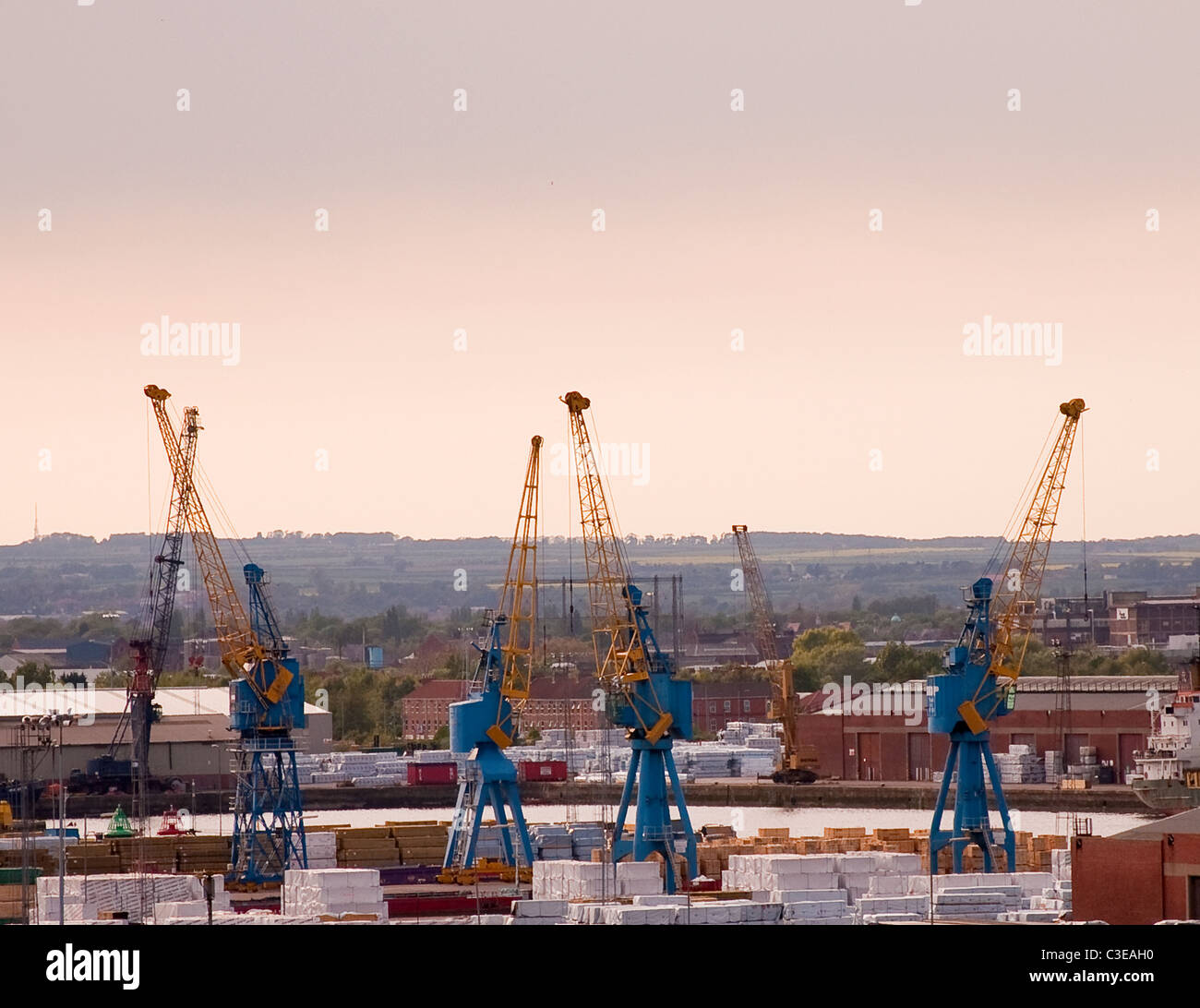 Colourful cranes at different angles at Hull docks Stock Photo - Alamy