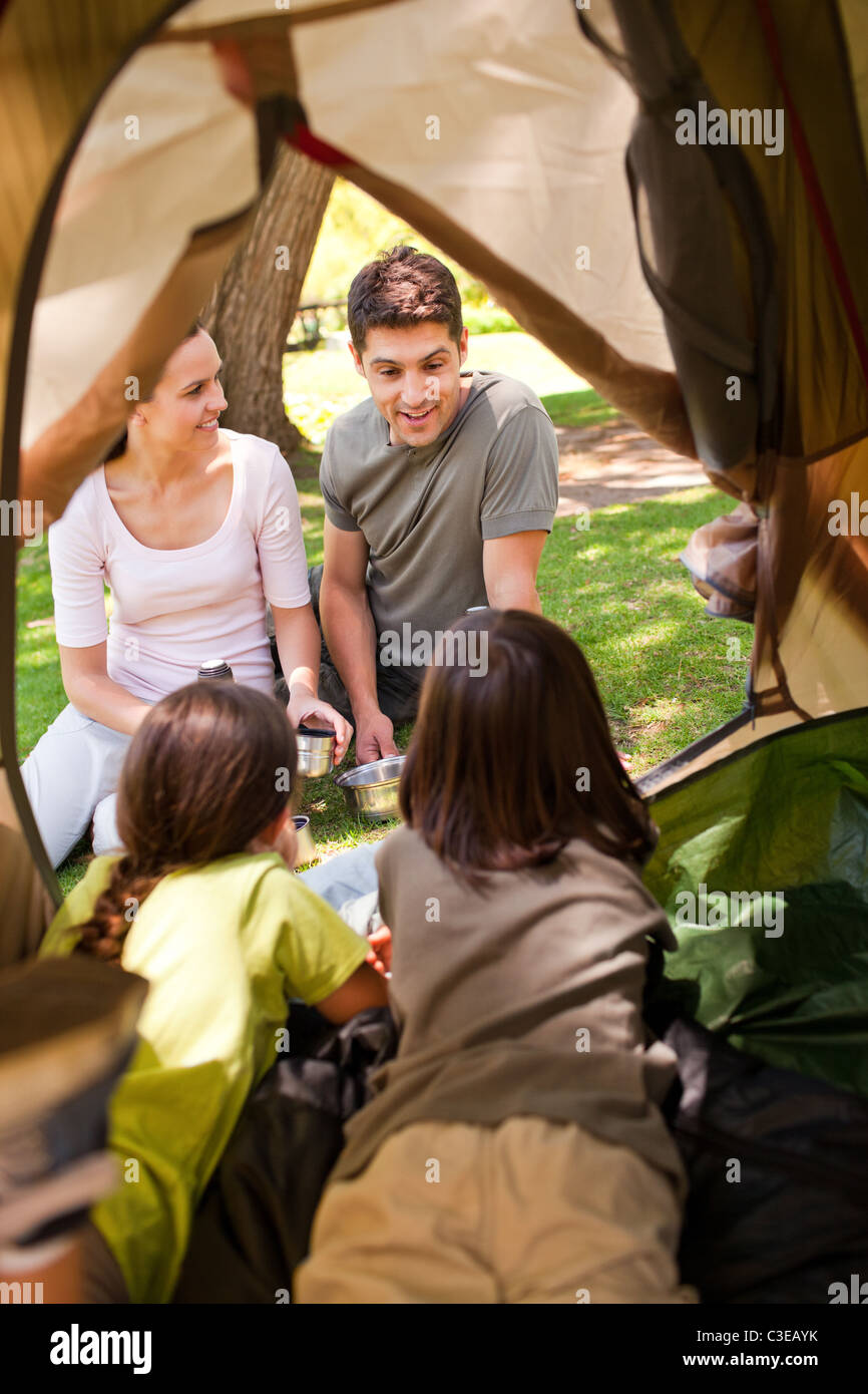 Happy family camping in the park Stock Photo - Alamy