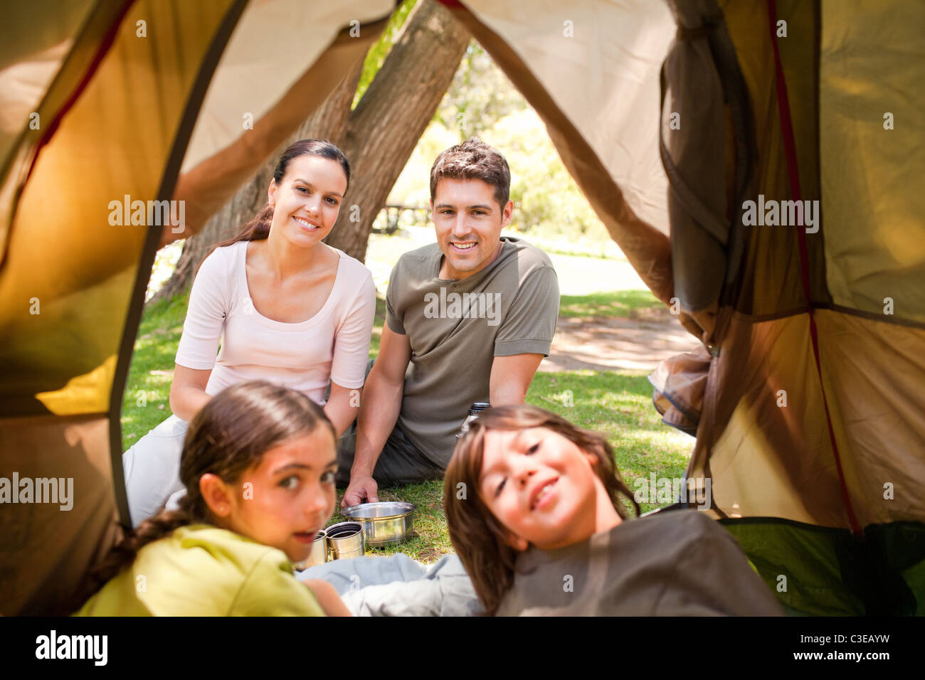 Happy family camping in the park Stock Photo - Alamy