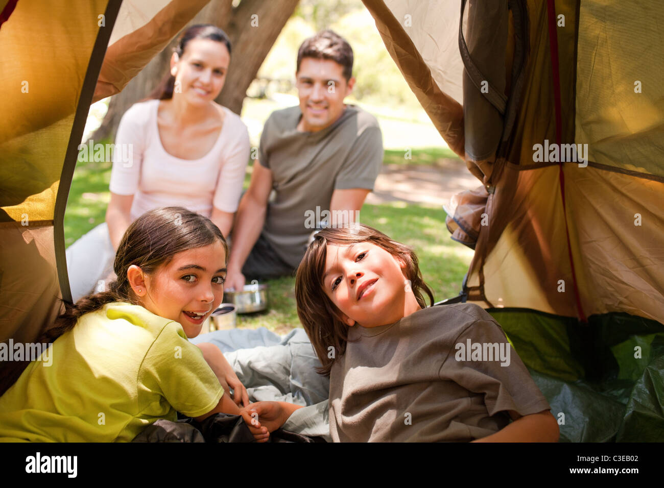 Happy family camping in the park Stock Photo - Alamy