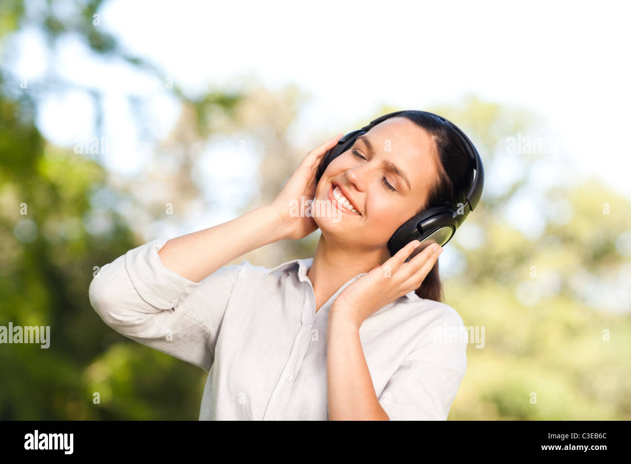 Beautiful woman listening to music Stock Photo - Alamy