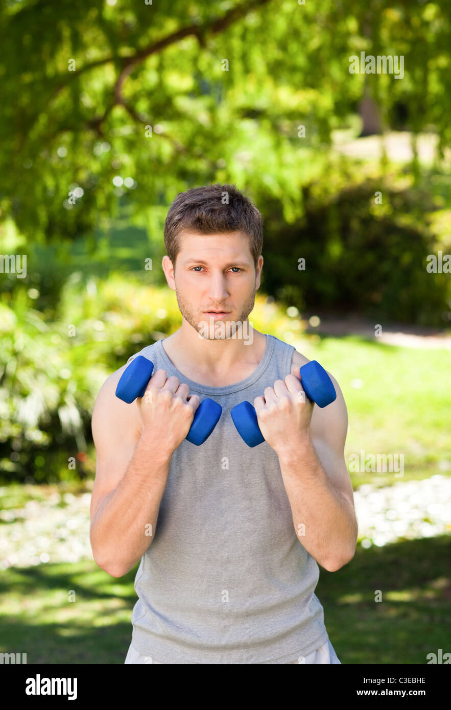 Man doing his exercises in the park Stock Photo - Alamy