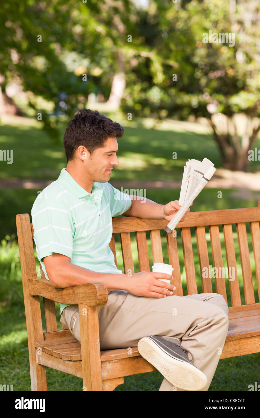 Man reading the newspaper Stock Photo - Alamy