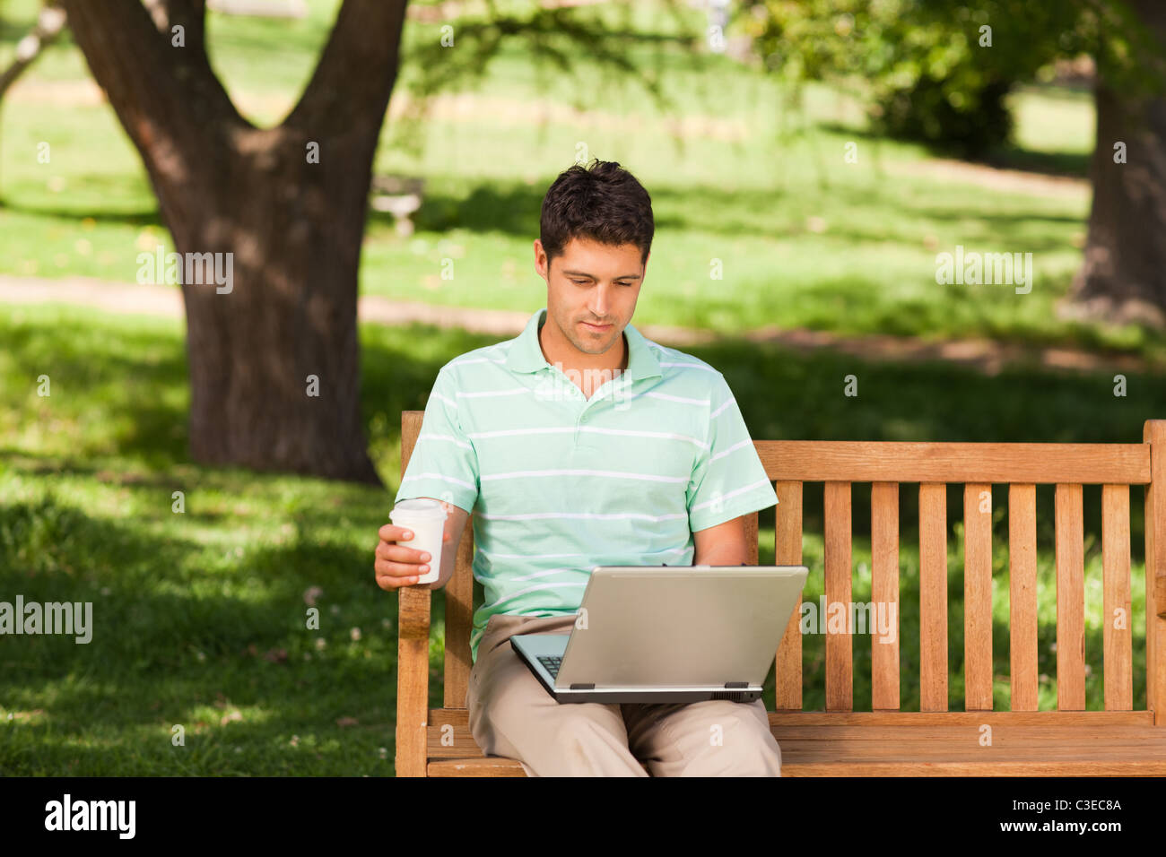 Man working on his laptop Stock Photo - Alamy