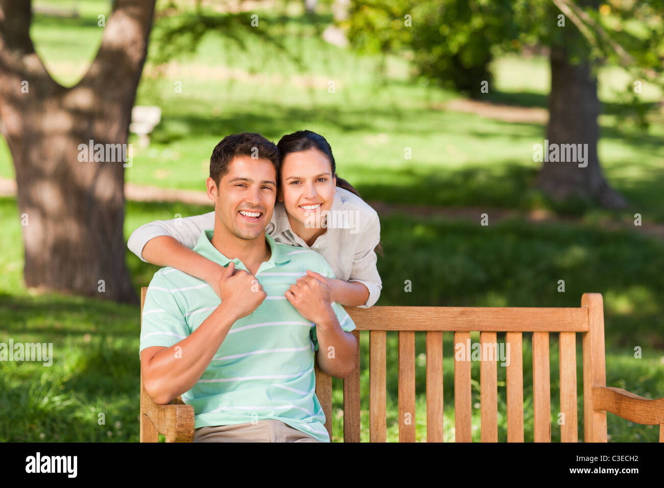 Woman huging her boyfriend Stock Photo - Alamy
