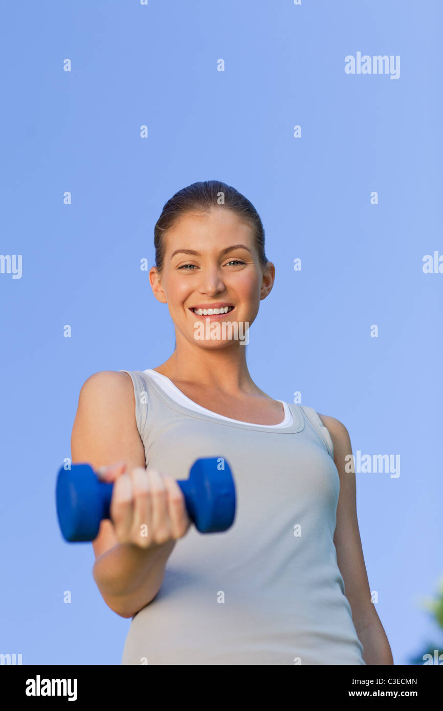 Woman in tracksuit sports exercises hi-res stock photography and images ...