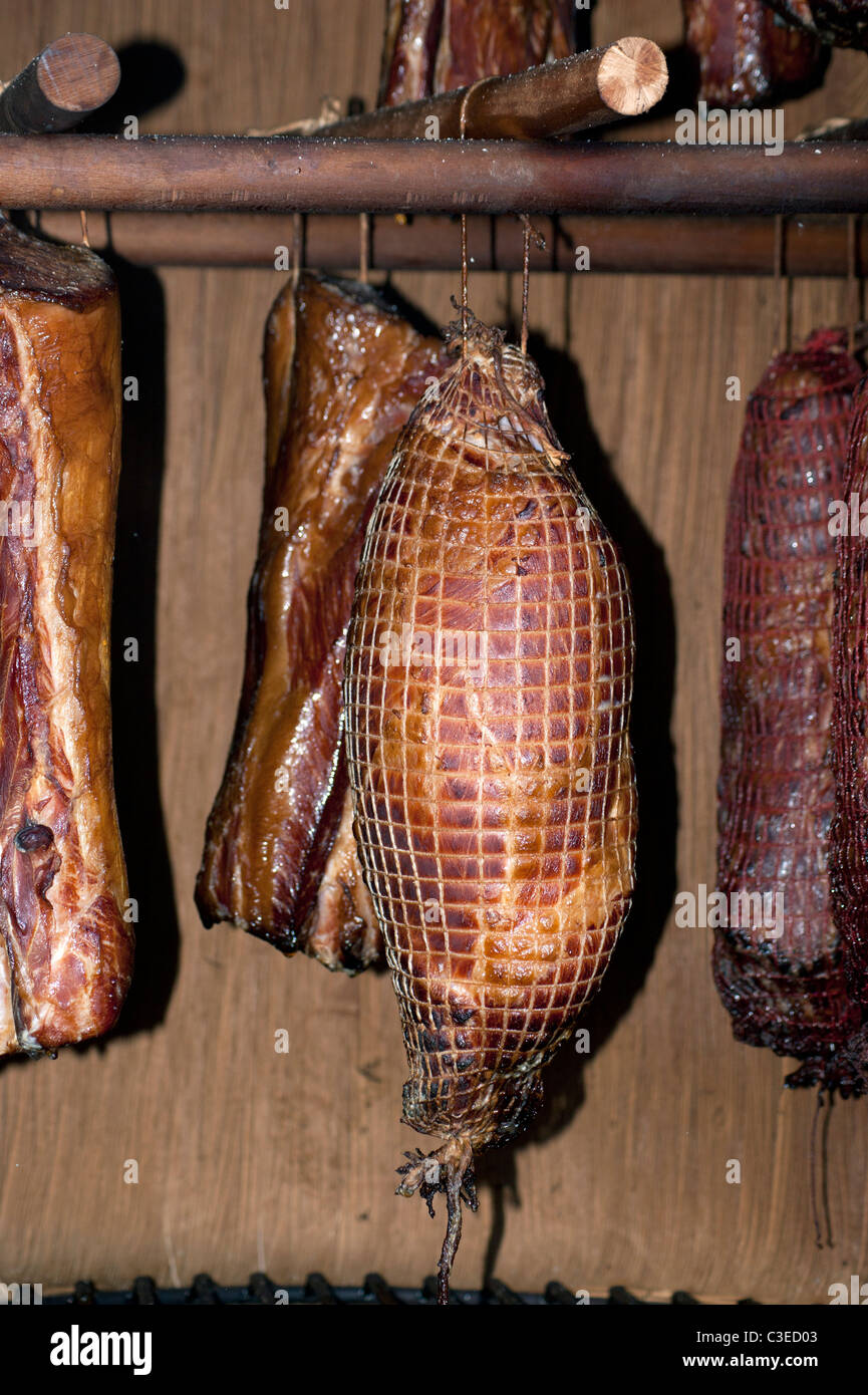 Hang gammon and bacon in wood smokehouse Stock Photo - Alamy