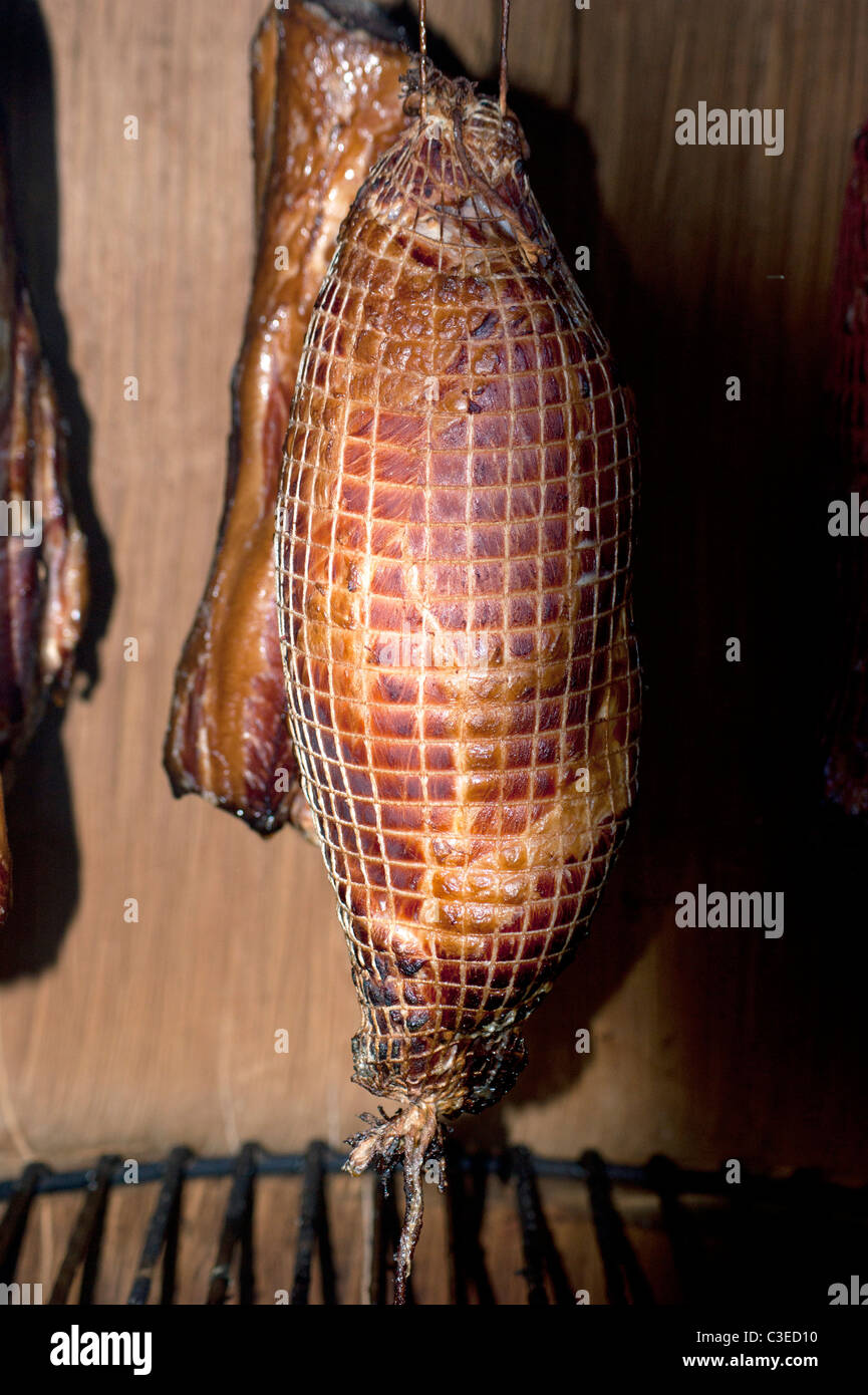 Hang gammon and bacon in wood smokehouse Stock Photo - Alamy