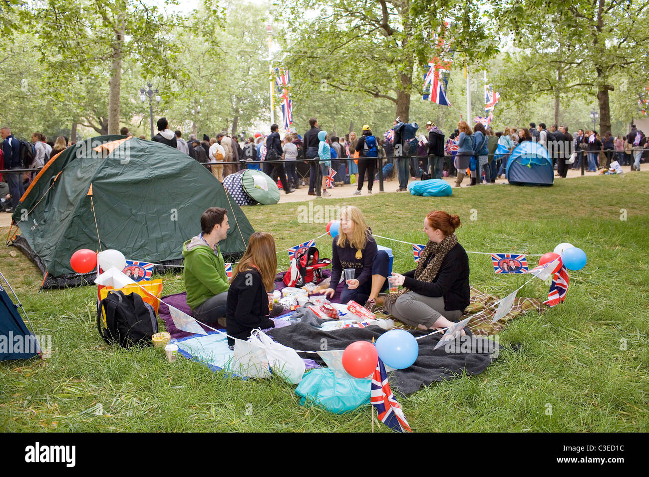 Four friends have a picnic in St. James's Park on the day of the royal ...