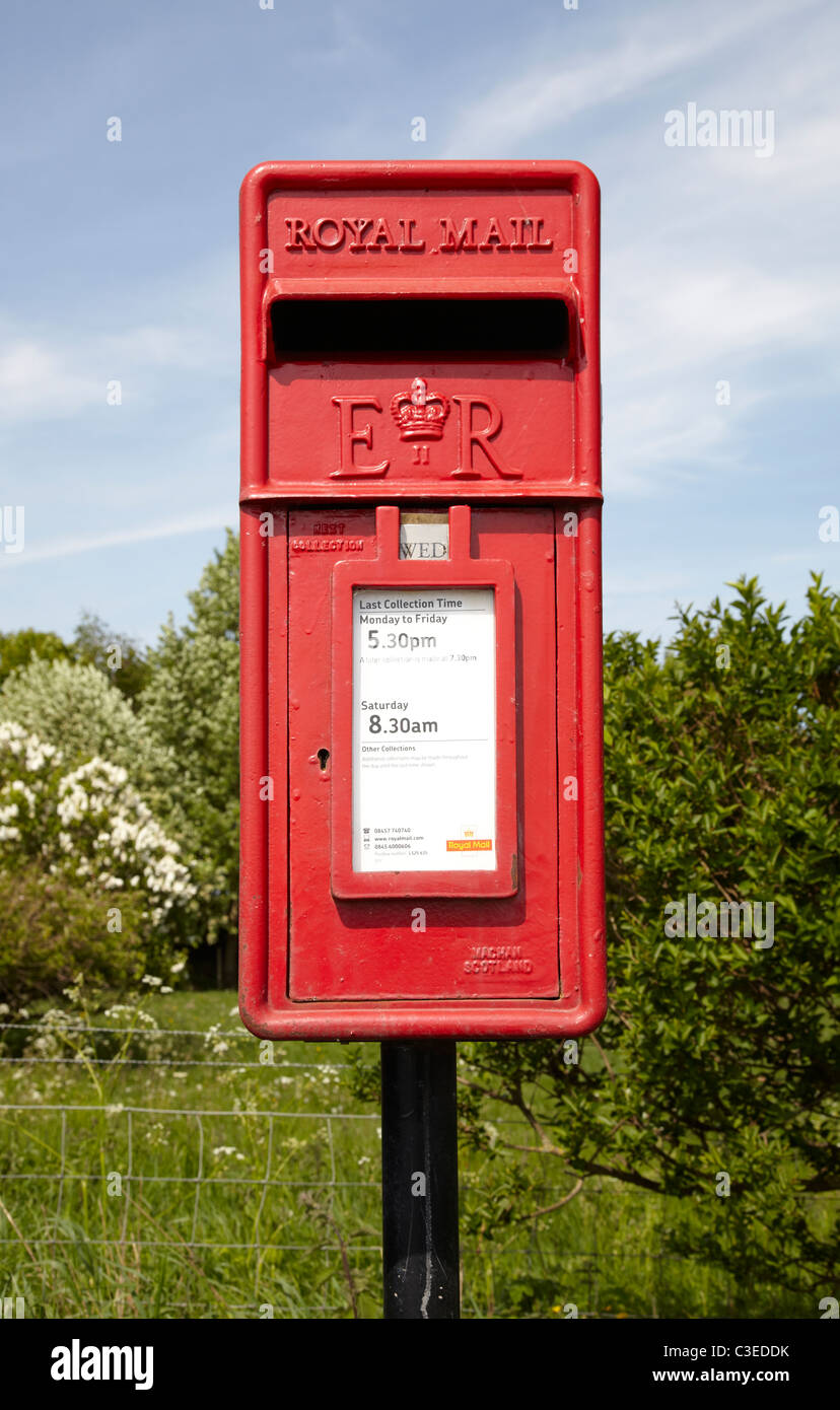 Royal mail post box on road side in rural setting. Showing small red ...