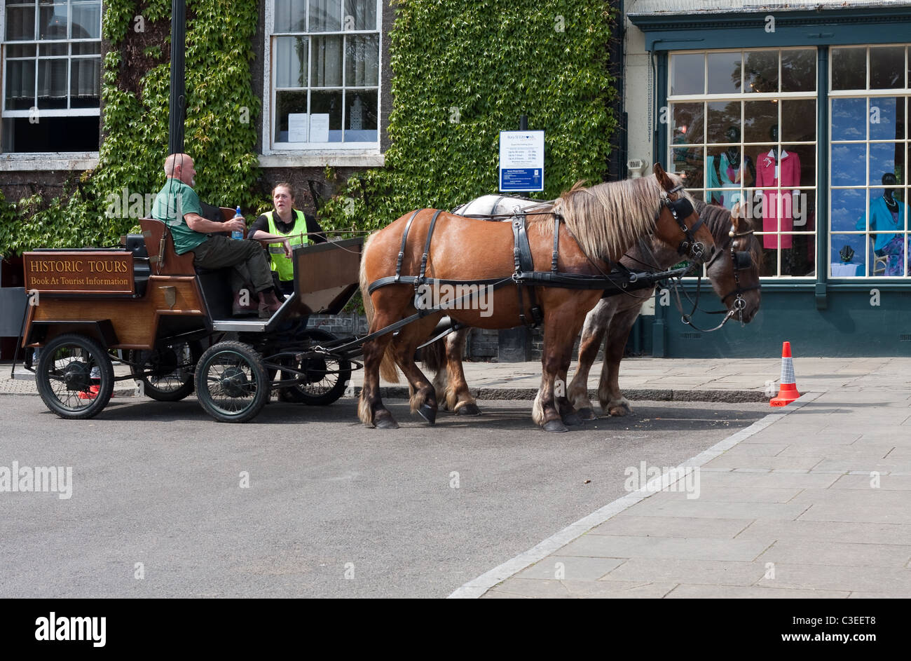 Old fashioned horses and cart for tourist rides in Angel Hill, Bury St ...