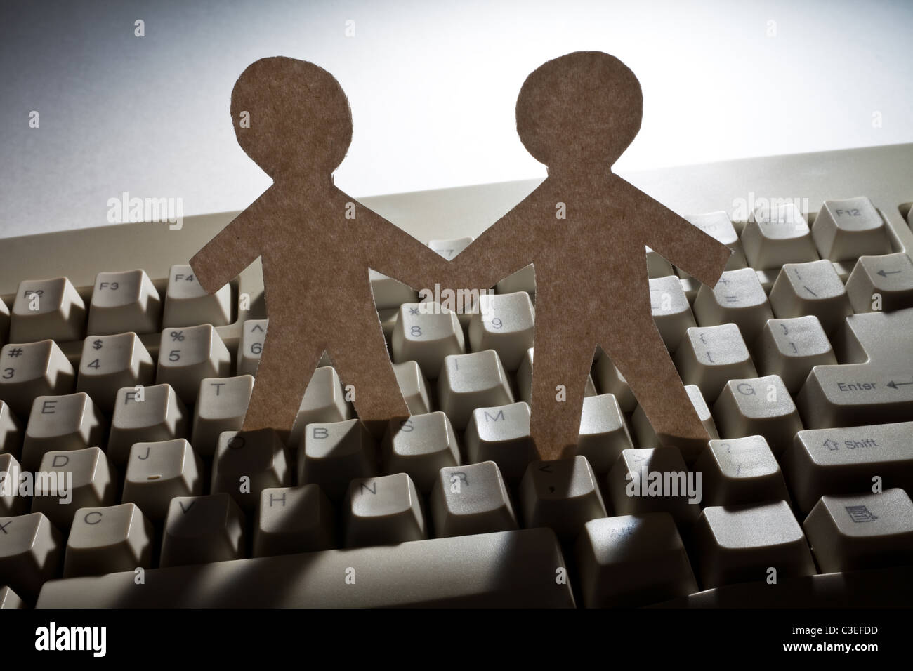 Paper Chain Men, concept of Friendship Stock Photo - Alamy