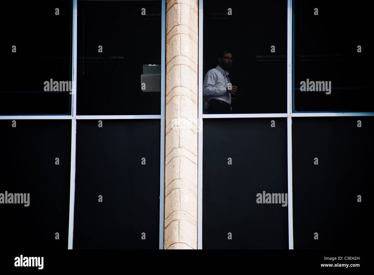 Man framed in window Stock Photo - Alamy