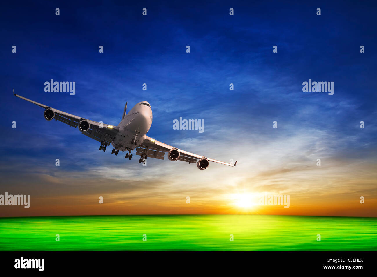 Jet in flight and sunset sky Stock Photo - Alamy