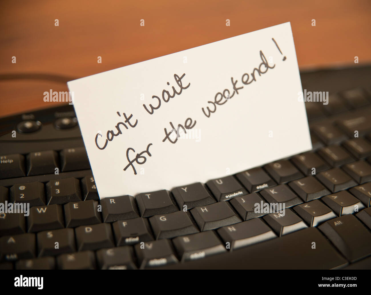 A note reading "Can't wait for the weekend" is tucked between the keys ...