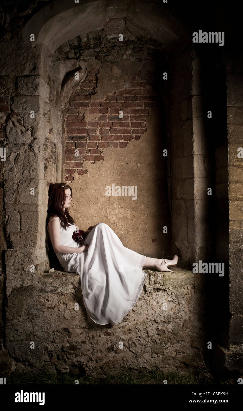 Sad bride at a church Stock Photo - Alamy