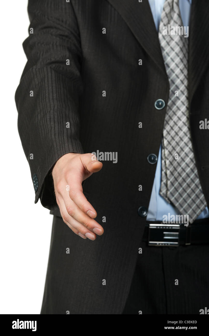 Businessman stretching out hand.Focus on hand, suit and tie blurred in ...