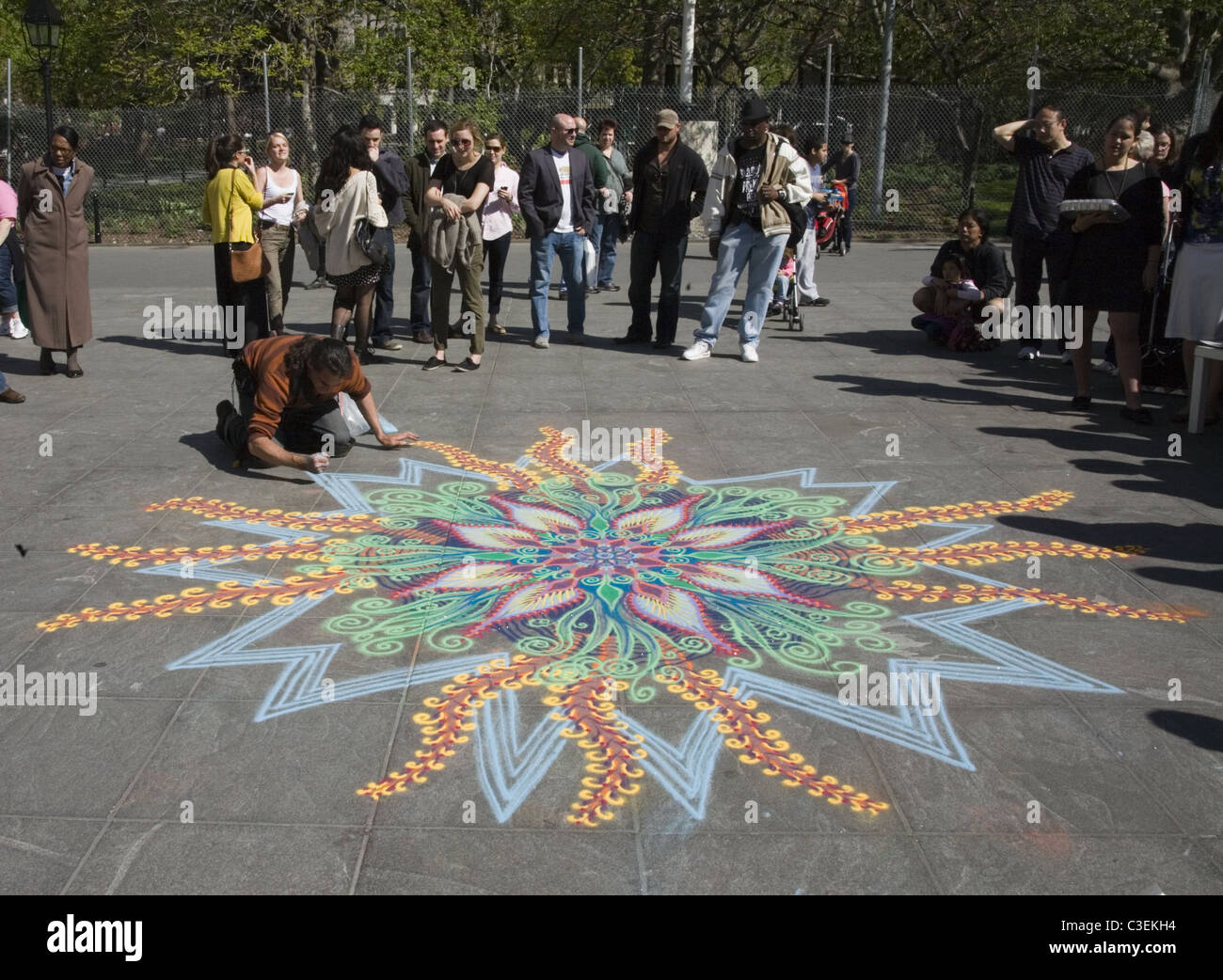 Sidewalk Artist creates a short lived work of Art on the pavement at ...