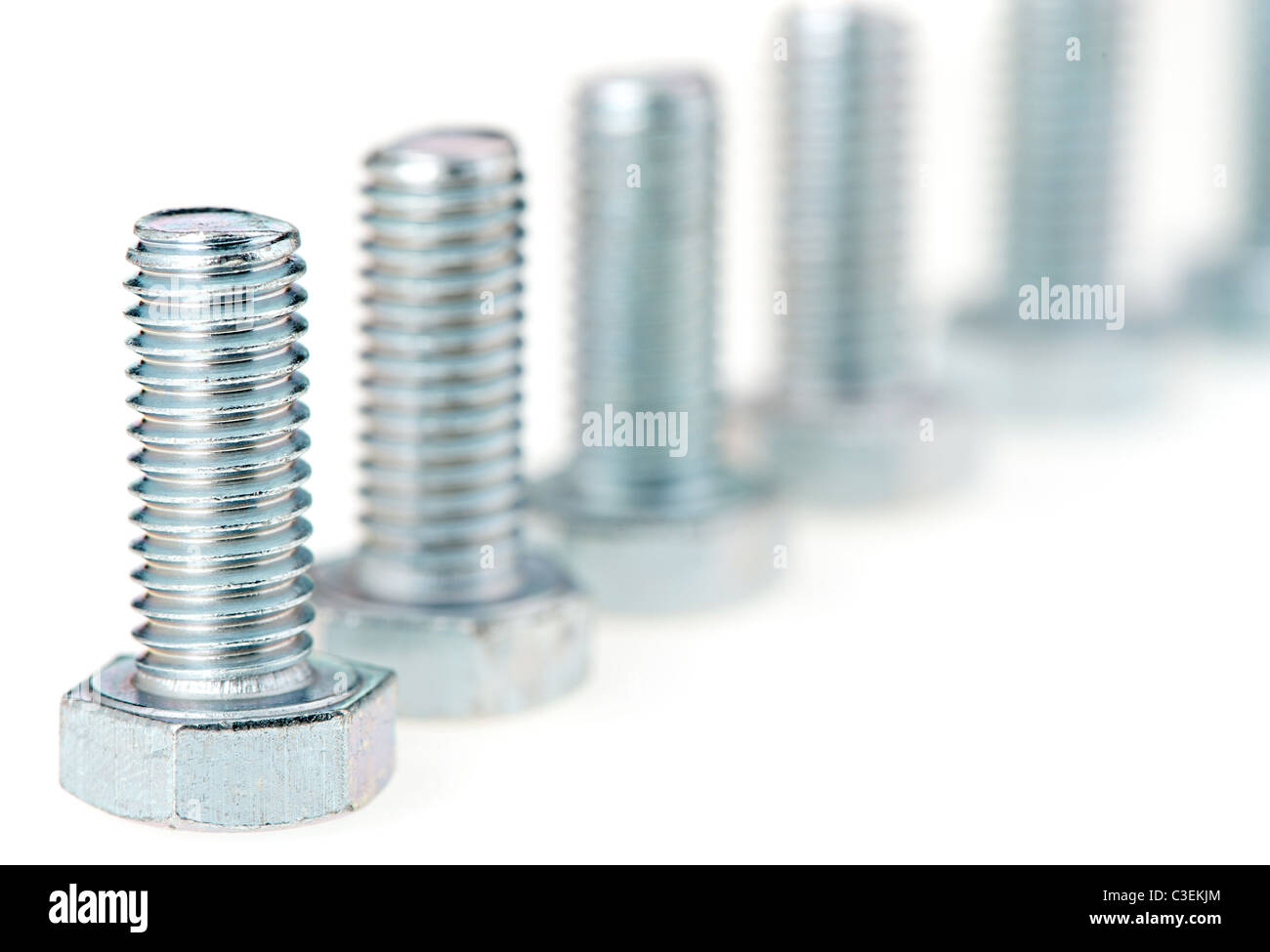Row bolt close up. Isolated on white background Stock Photo - Alamy