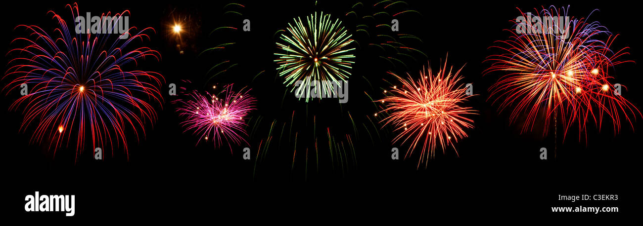 Line of fireworks over black background Stock Photo - Alamy