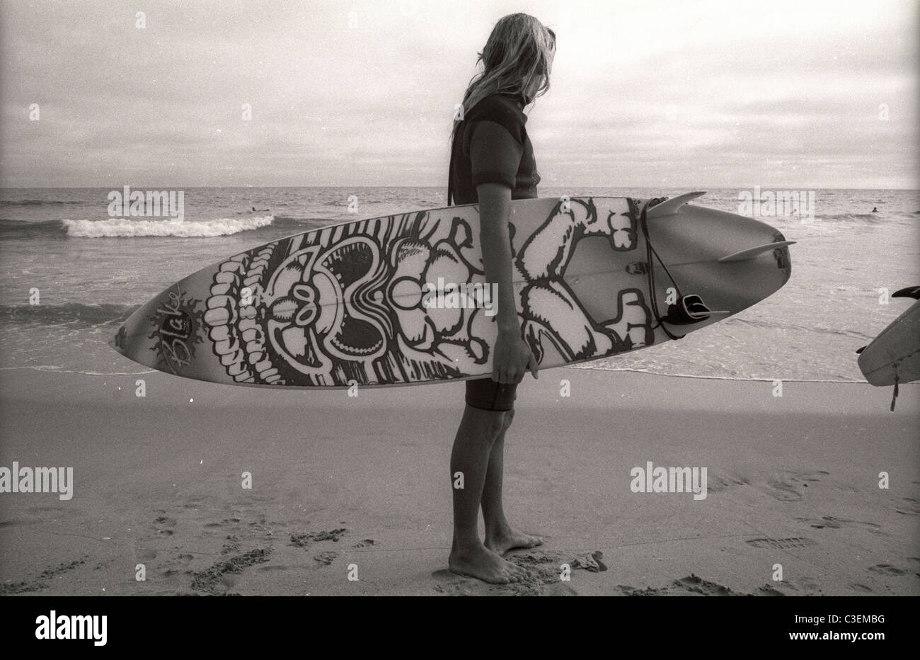 one surfer on Newport Beach with surfboards at sunset 1991 1990s ...