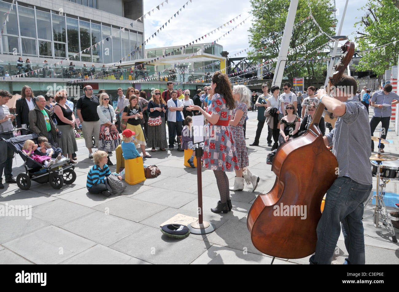 Crowd watching singers musicians playing singing double bass jazz live ...