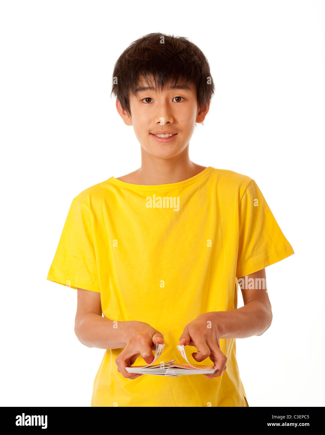 teenage Chinese Asian boy shuffling deck of cards Stock Photo - Alamy