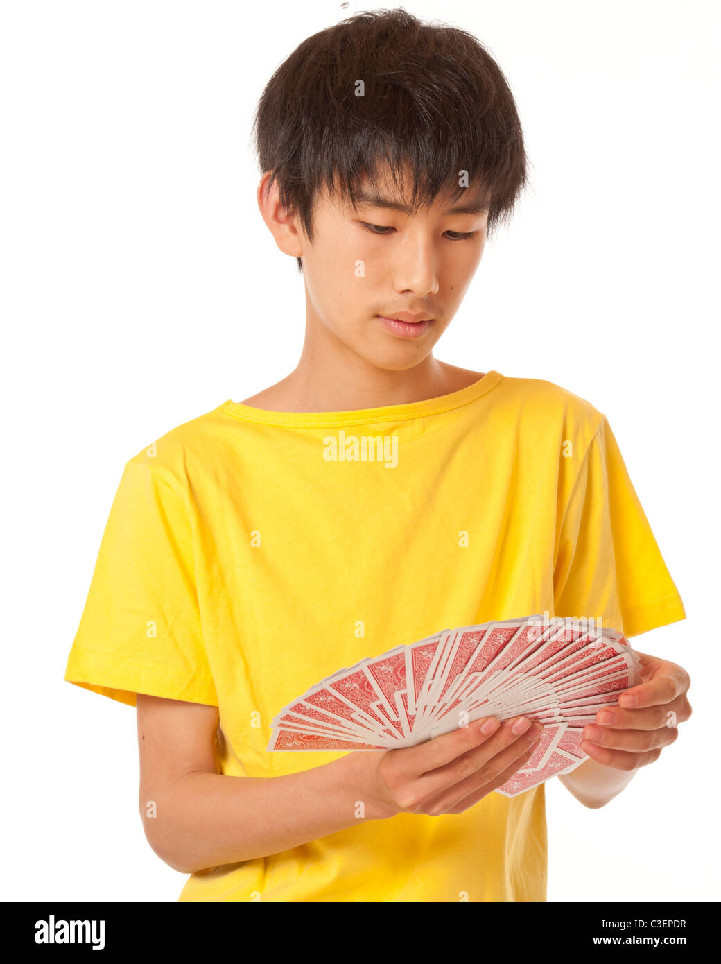 teenage Chinese Asian boy playing with cards Stock Photo - Alamy