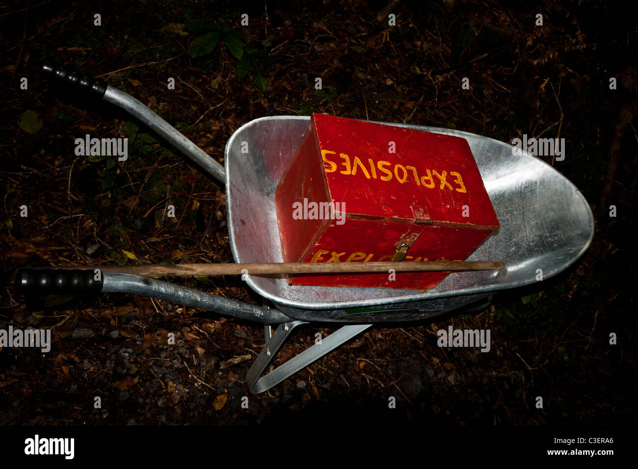 Barrow with red wooden box full of explosives in dark forest Stock ...