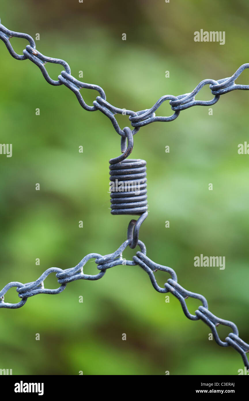 Old bed spring and chains abstract Stock Photo - Alamy