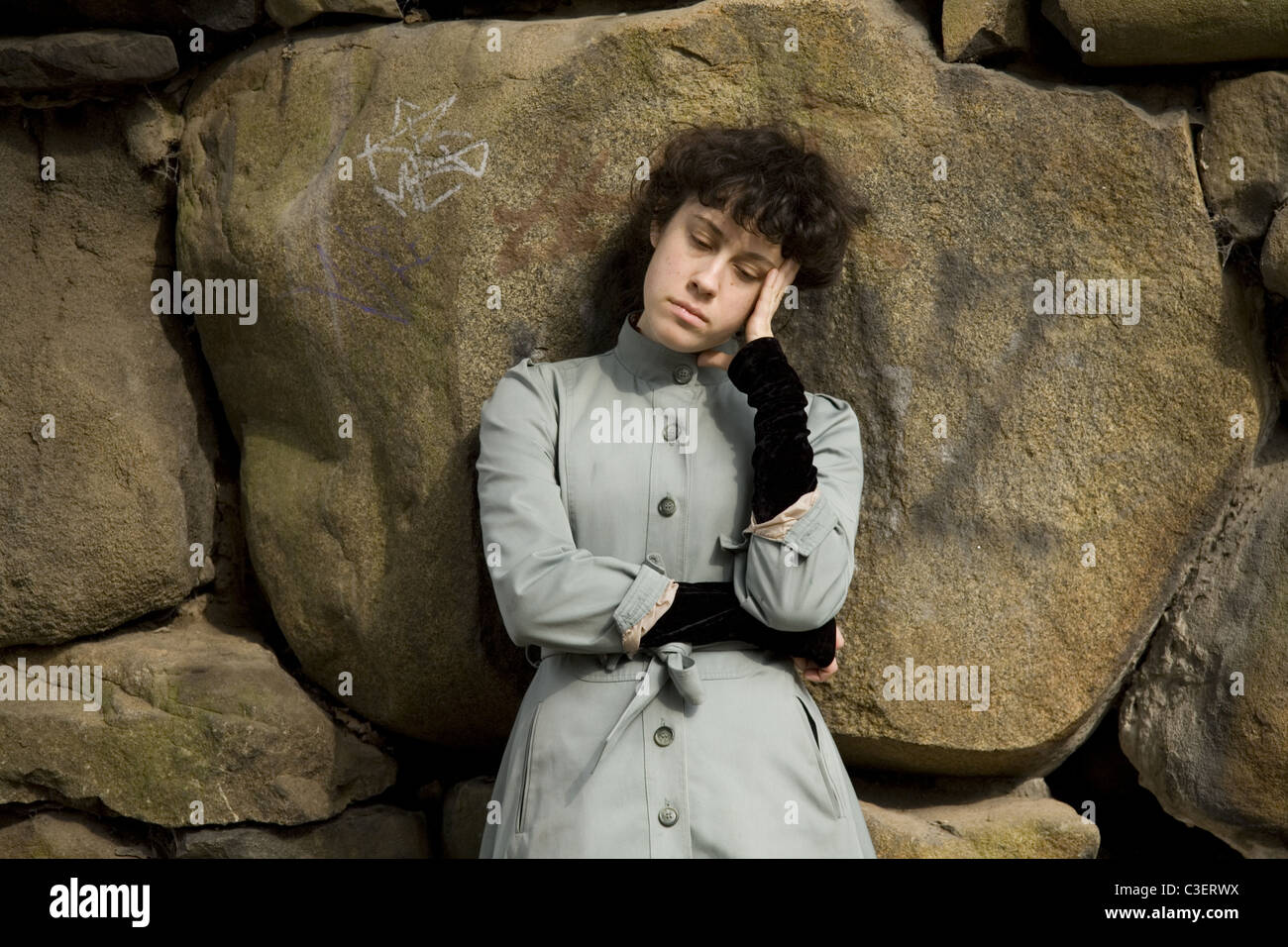 Young woman alone under a stone bridge in Prospect Park, Brooklyn, NY ...