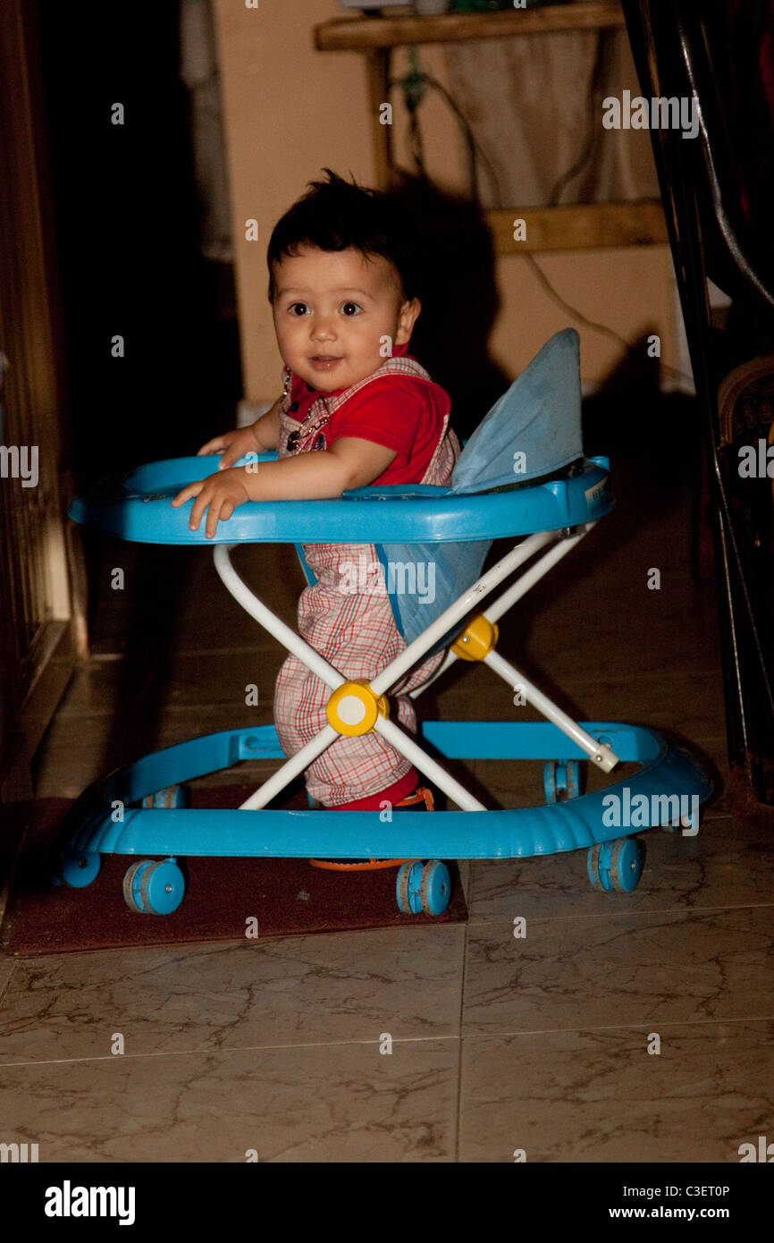 Little Boy learning how to walk and having fun at the same time Stock ...