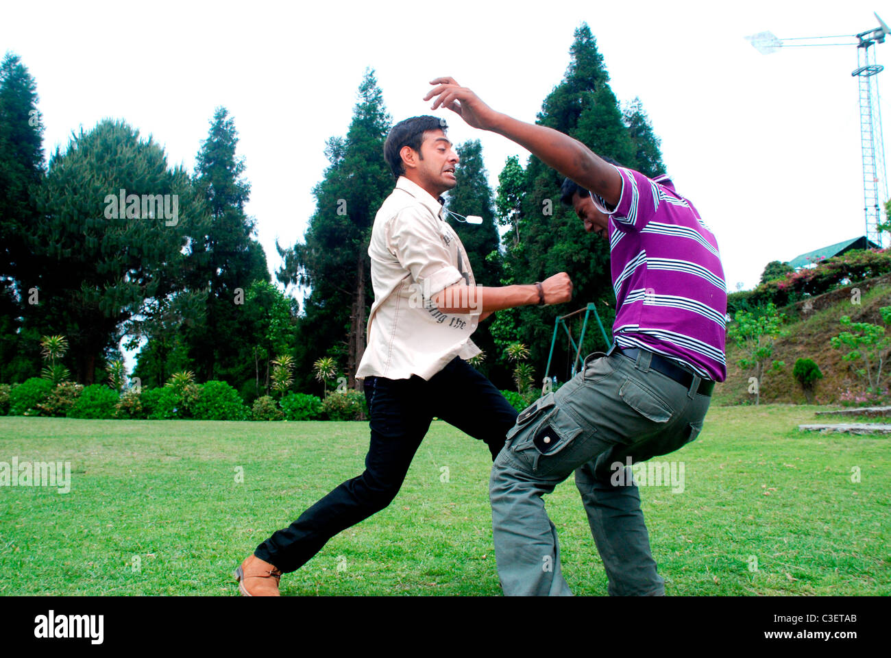 Two Indian fighting in a film shooting Stock Photo - Alamy