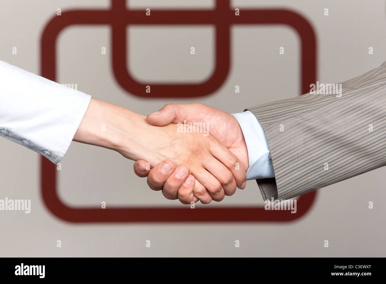 Photo of partners’ hands making agreement by handshaking Stock Photo ...