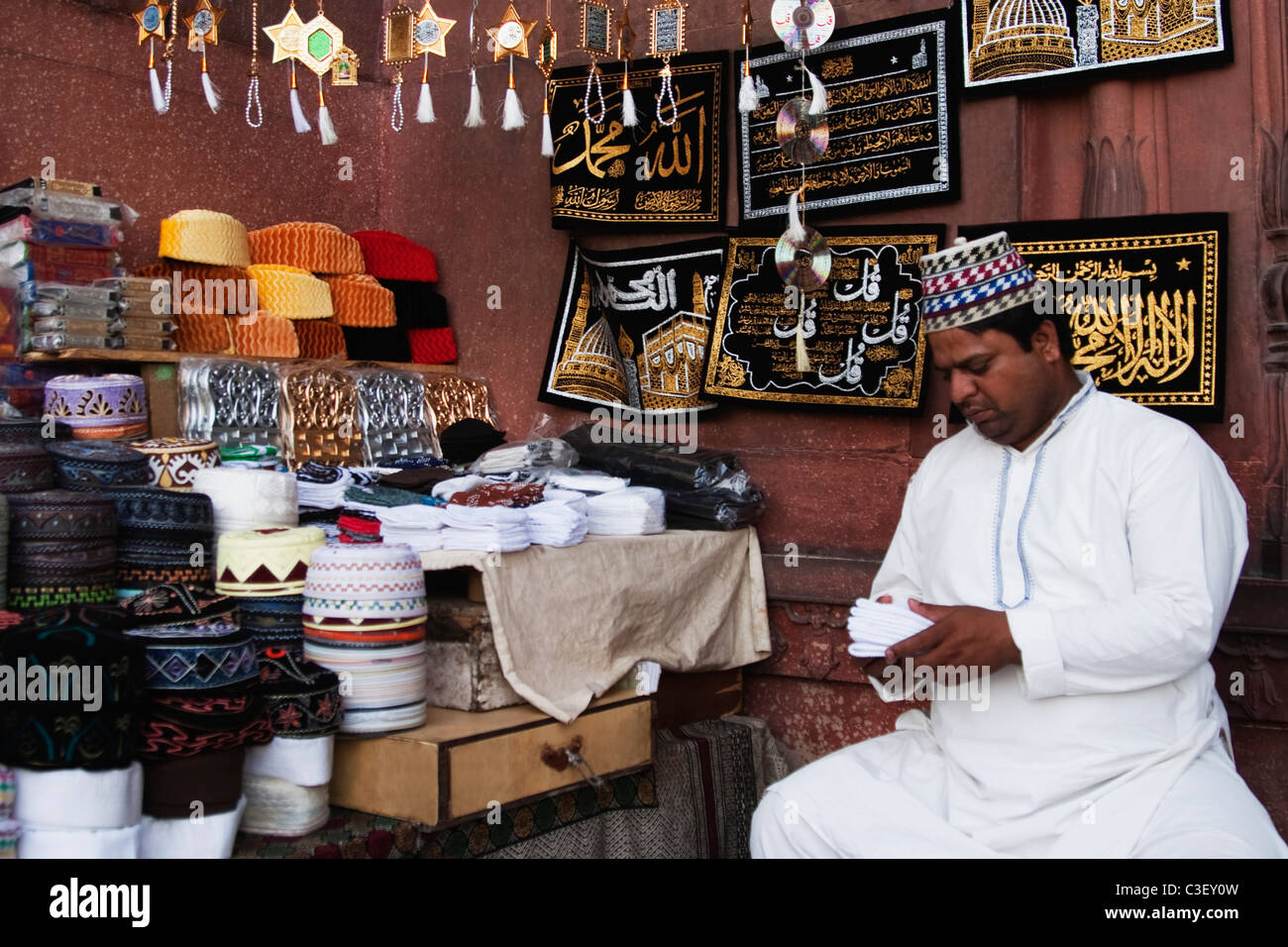 Man selling religious objects at stall, Red Fort, Delhi, India Stock ...