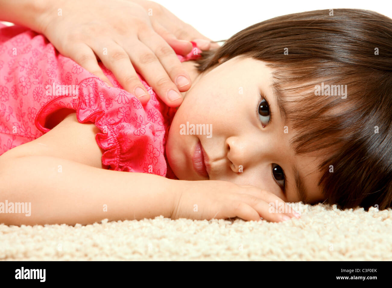 Portrait of small girl relaxing with serene expression Stock Photo - Alamy