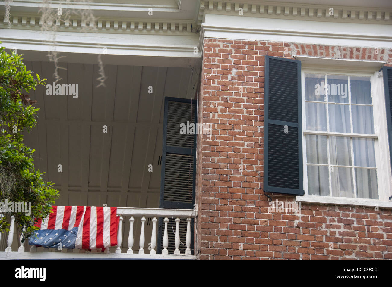 South Carolina, Beaufort. Historic home with US flag on balcony Stock ...