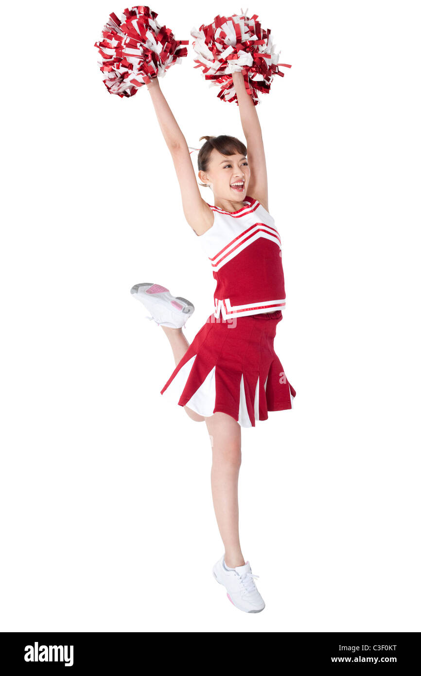 Cheerleader in action with her pom-poms Stock Photo - Alamy