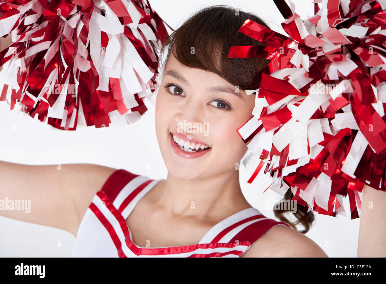 Portrait of a cheerleader in red Stock Photo - Alamy
