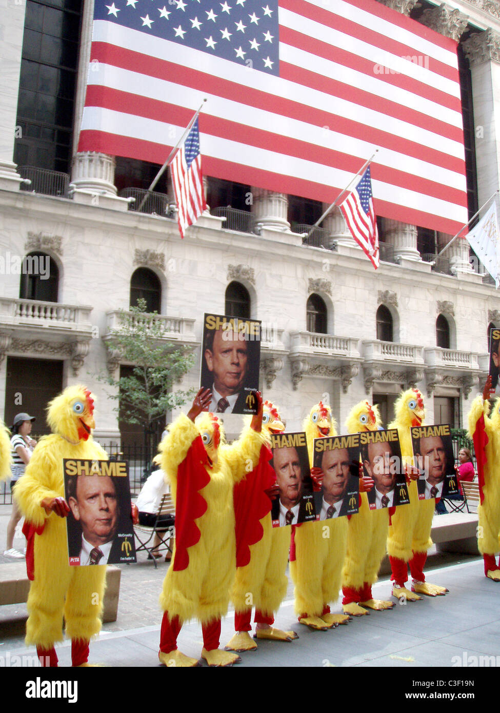 PETA members in giant chicken costumes protest McDonald's CEO Jim ...