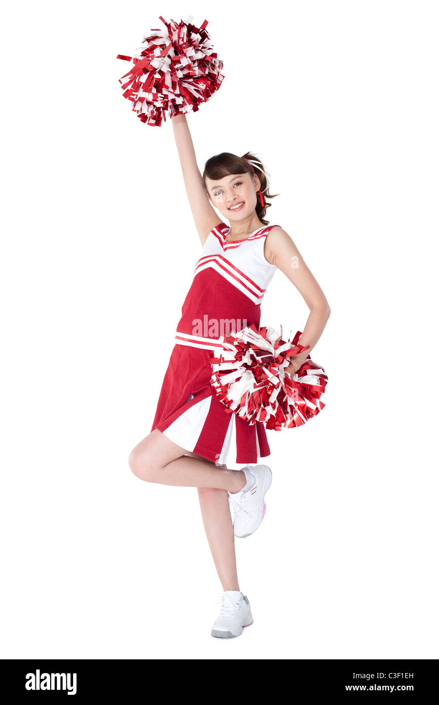 Cheerleader in action with her pom-poms Stock Photo - Alamy