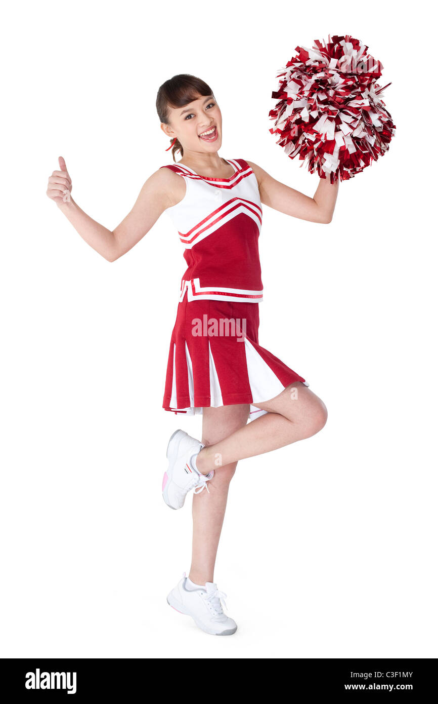Cheerleader in action with her pom-poms Stock Photo - Alamy