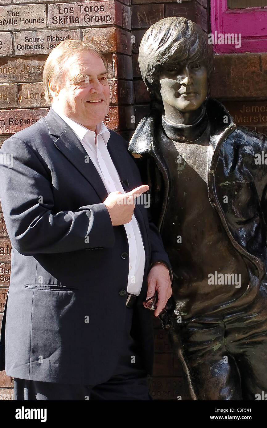 John Prescott poses with John Lennon's statue on Matthew Street while ...