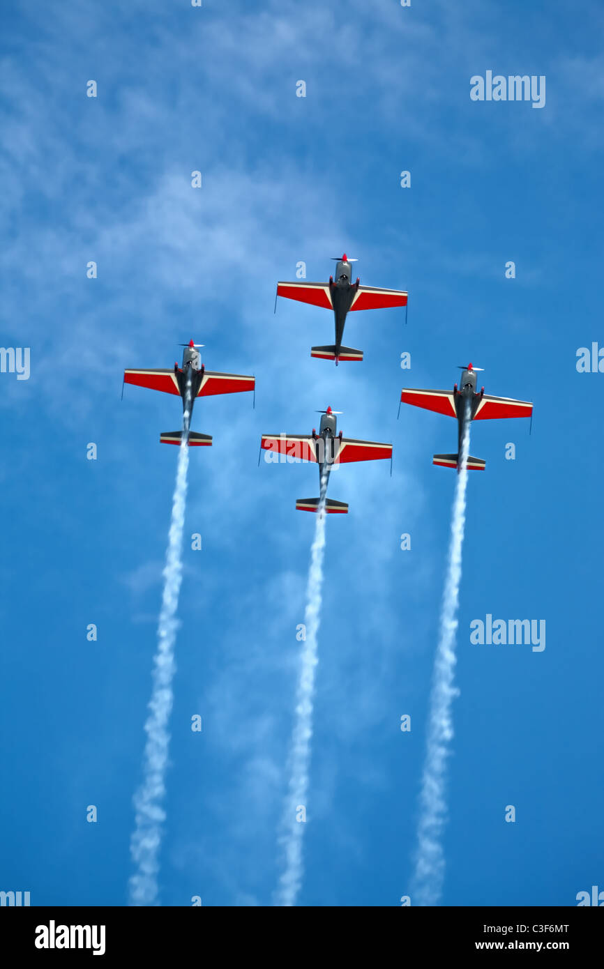 four airplanes in formation on airshow Stock Photo - Alamy