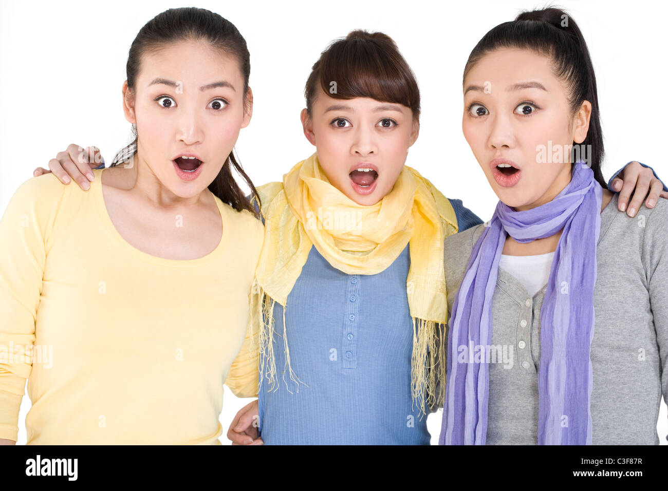 Portrait of three shocked women Stock Photo - Alamy
