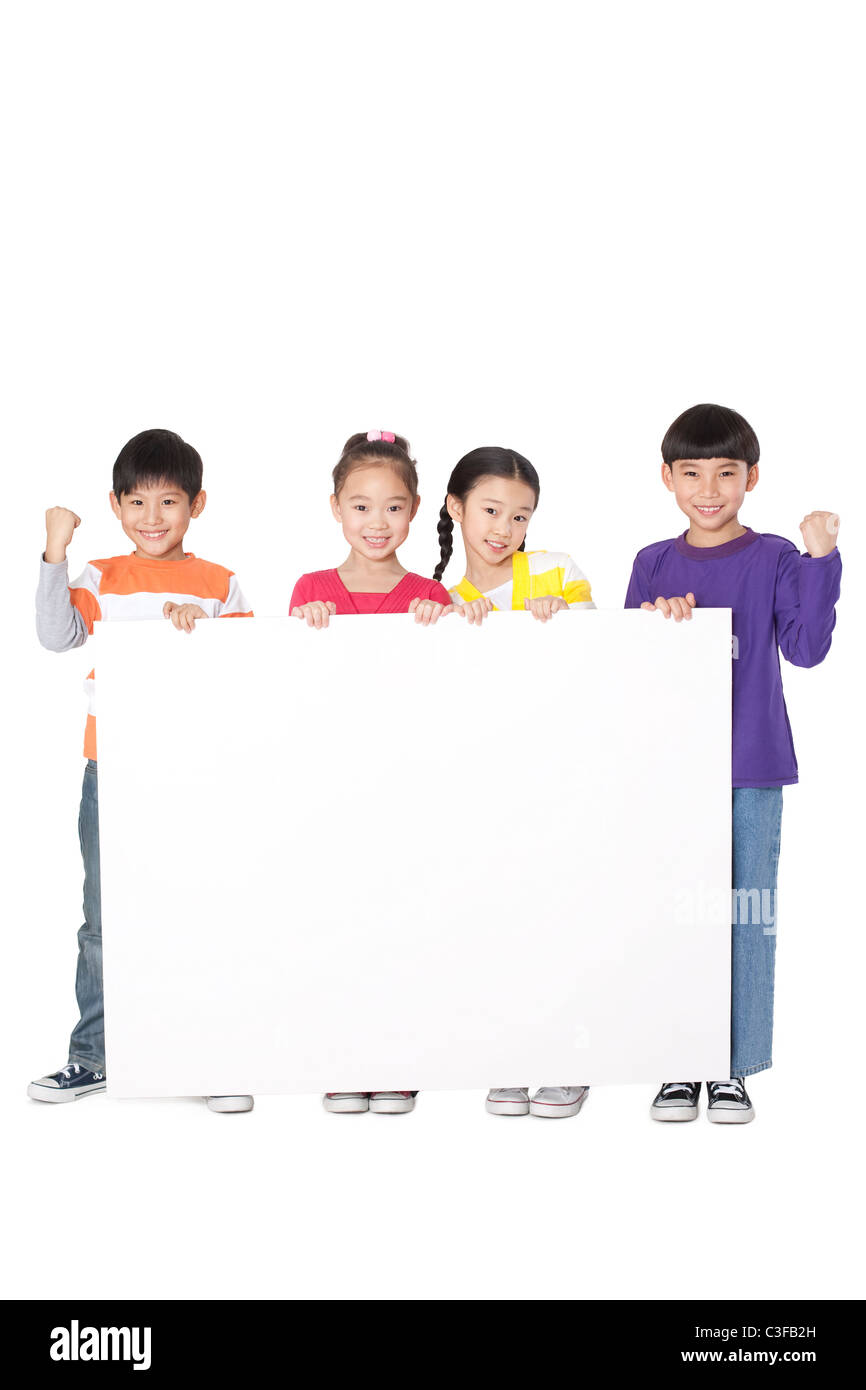 A group of classmates holding up a blank sign Stock Photo - Alamy